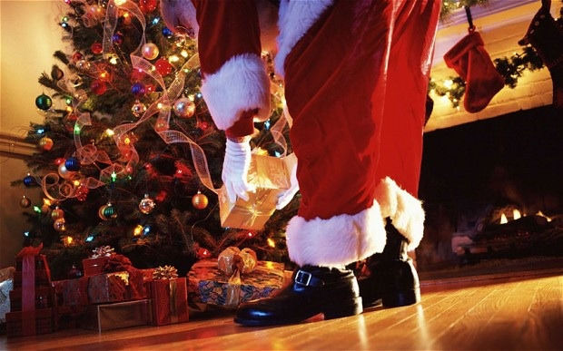 Santa Putting Gifts Under The Tree Pictures, Photos, and Images for ...