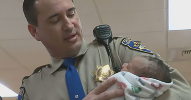 Cop saves baby's life who stopped breathing after he was born at the side of the highway